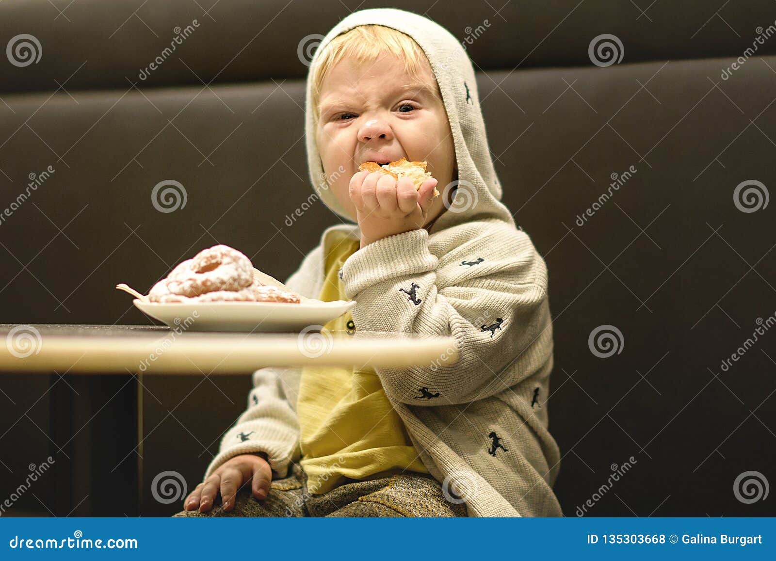 Little Boy is Eating the Buns. Stock Photo - Image of buns, tasty ...