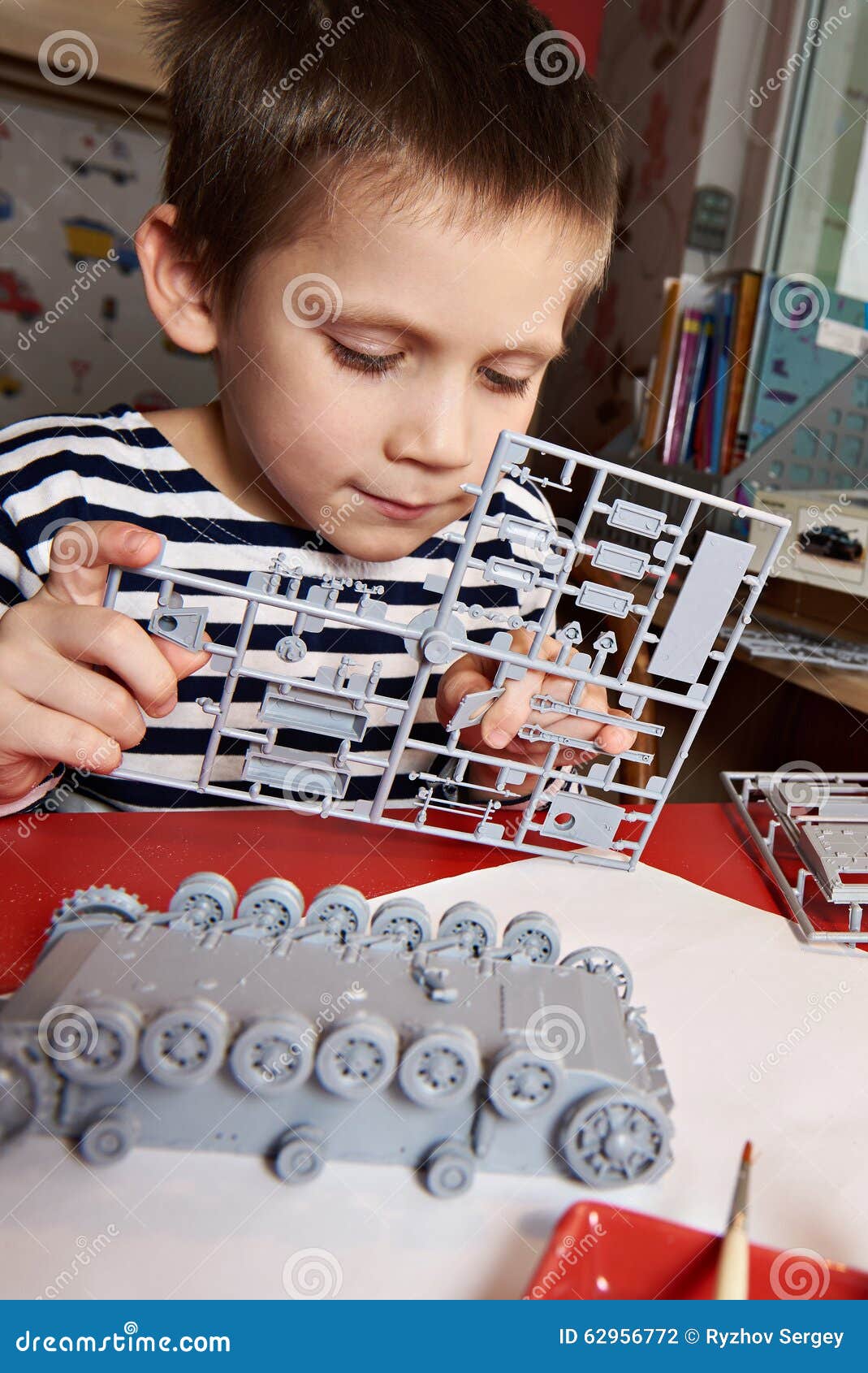 Little Boy Collects Plastic Model Tank Stock Photo - Image of assembly ...
