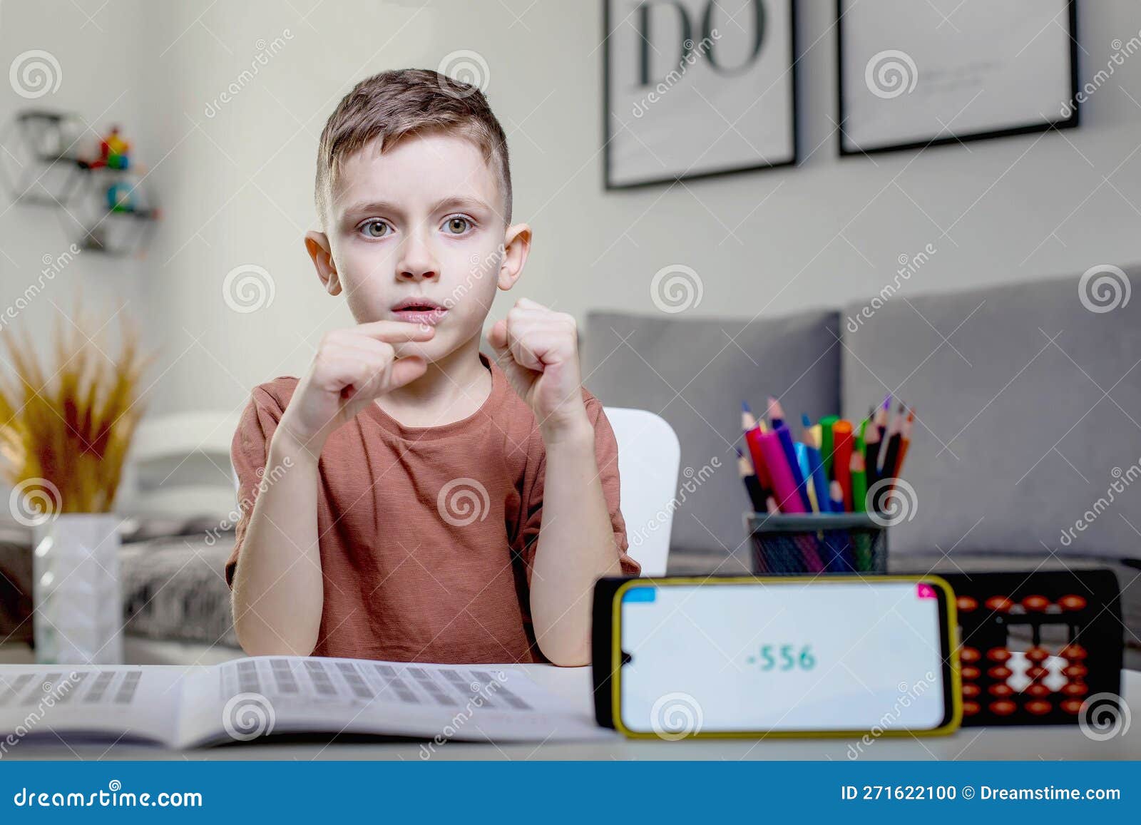 Little Boy Counting with the Help of Mental Arithmetic. Mathematics in ...