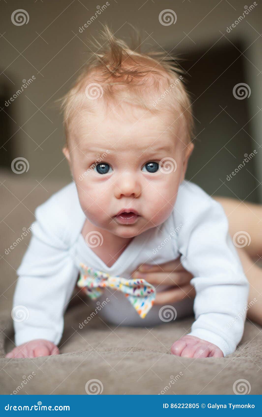 Little Boy Crawling on the Bed and Looking at the Camera Stock Image ...