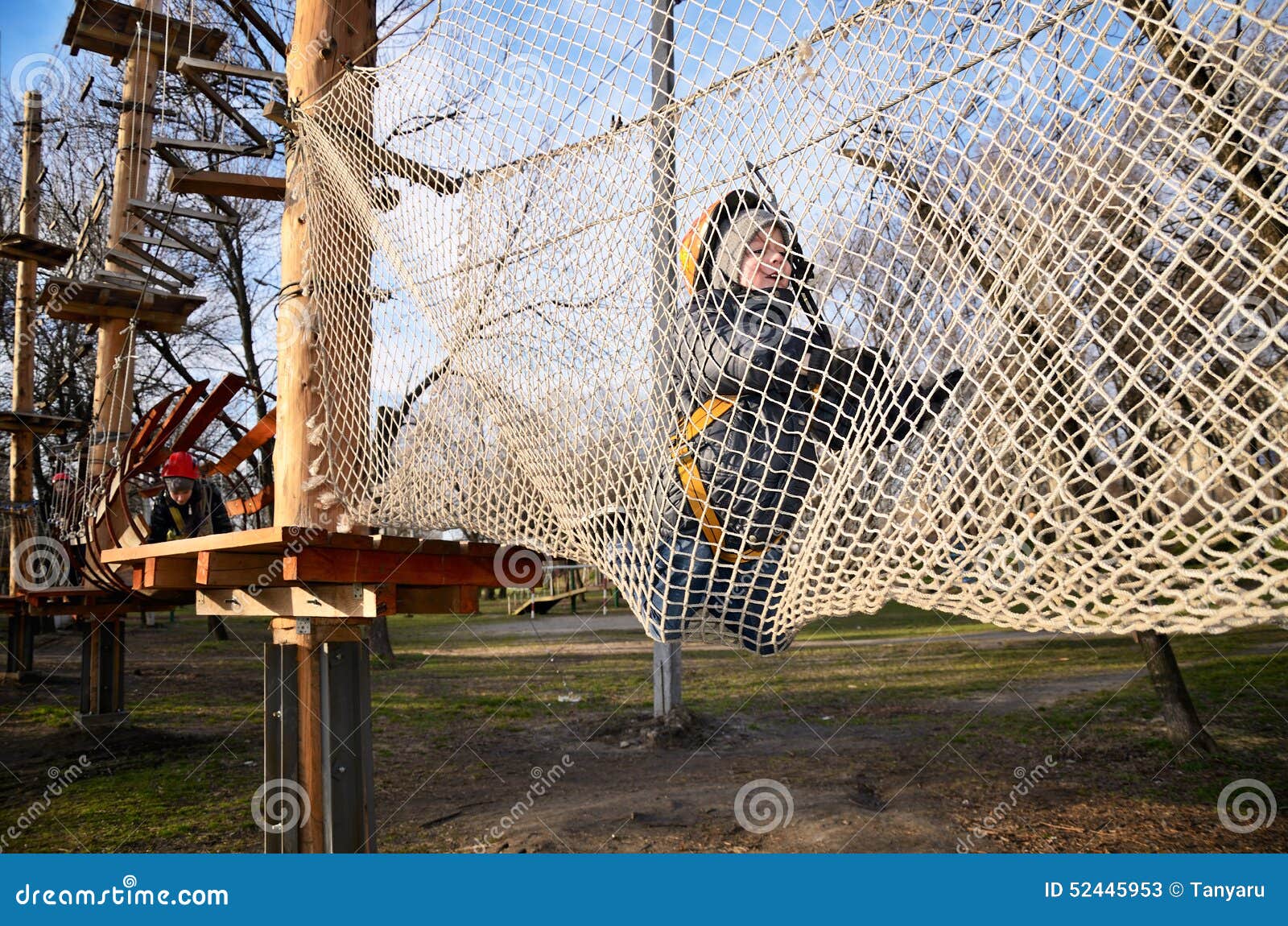 Little Boy Crawling on Suspension Net Bridge. Horizontal Stock Image ...