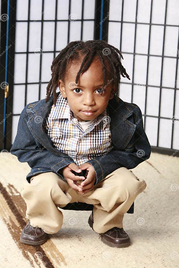 Little boy crouching stock image. Image of family, cute - 432301