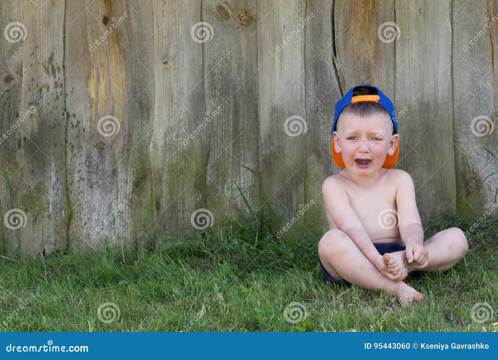 Little Boy is Crying Alone in the Grass Stock Photo - Image of copy ...