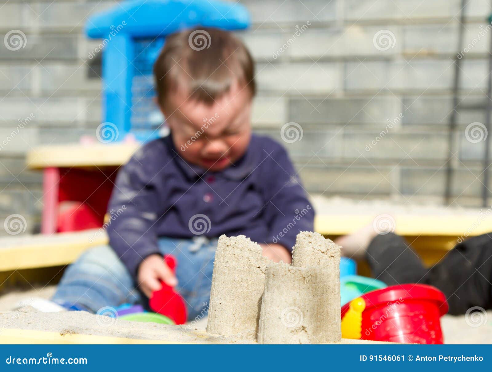 A Little Boy Crying in the Sandbox. Blurred Focus Stock Image - Image ...