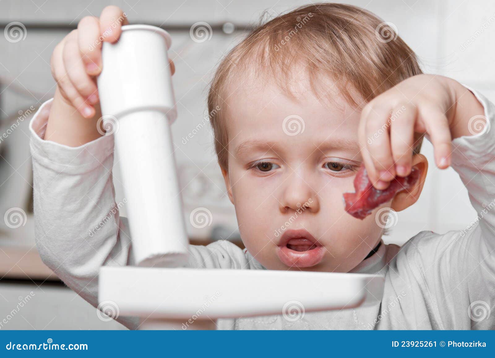 Little boy cutting meat stock image. Image of food, little - 23925261