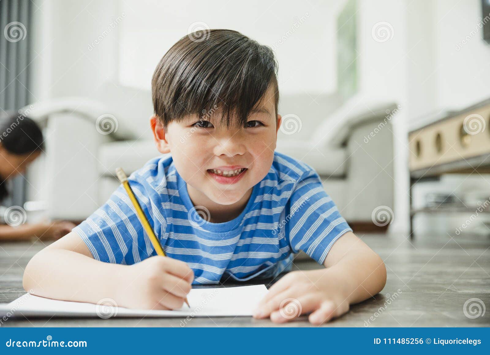 Little Boy Doing His Homework on the Floor Stock Photo - Image of asian ...