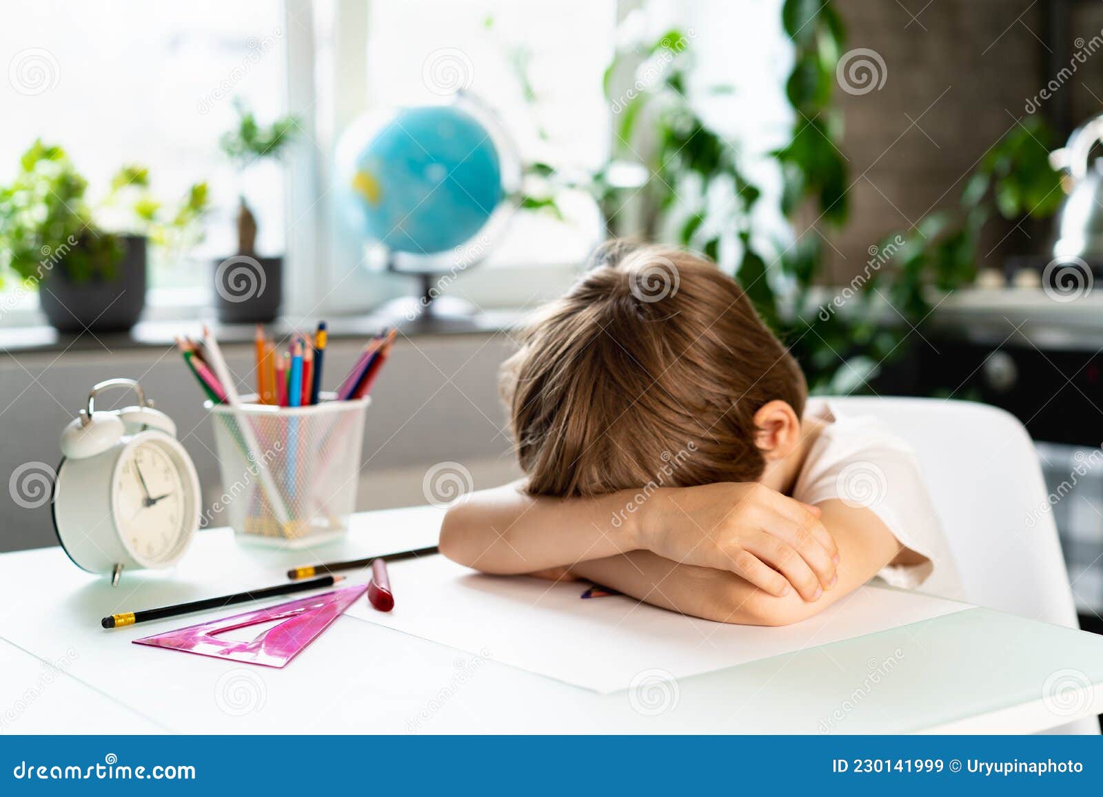 Little Boy Doing Homework at Home at the Table, Overwork of a First ...