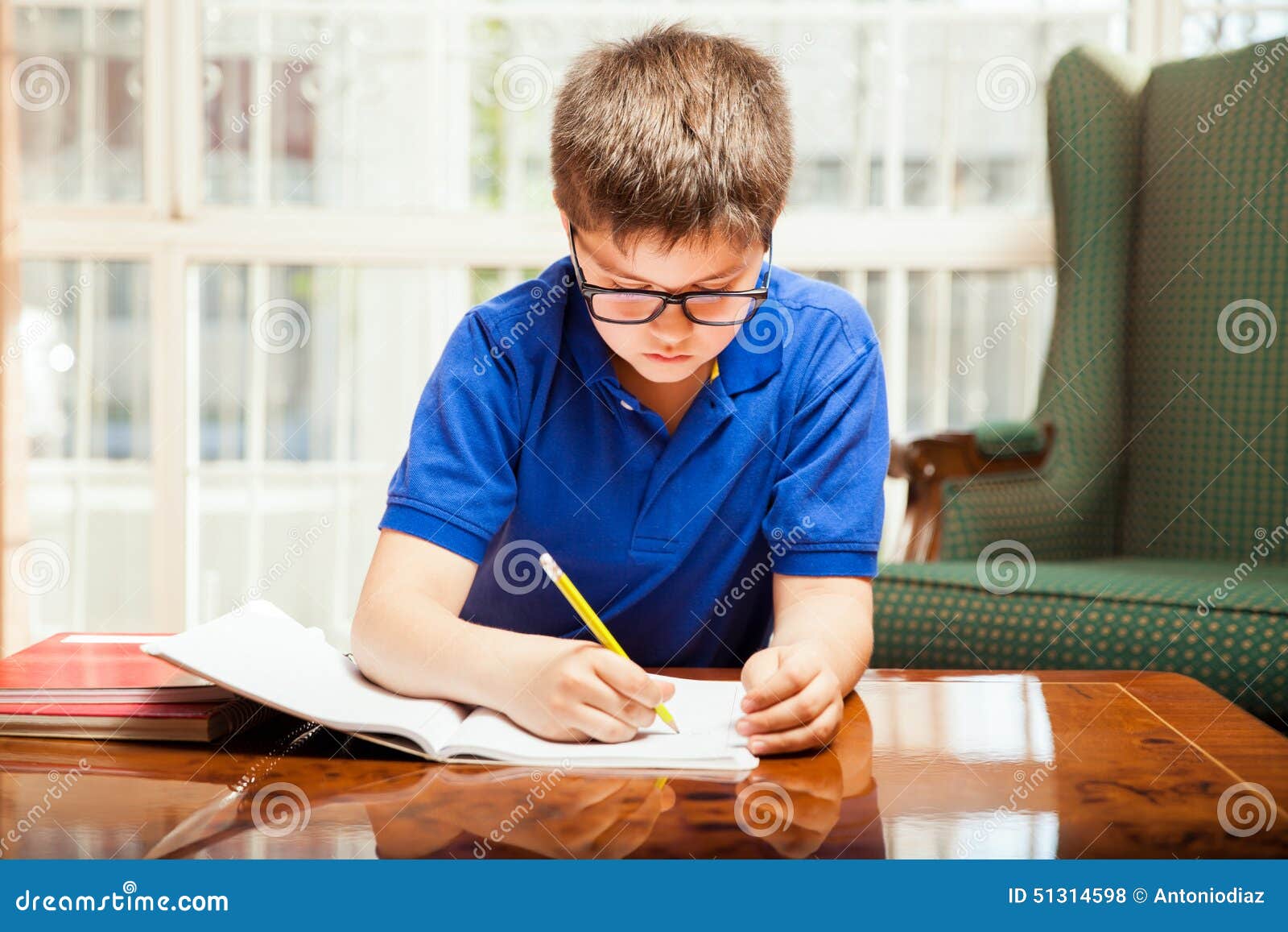 Little boy doing homework stock photo. Image of space - 51314598