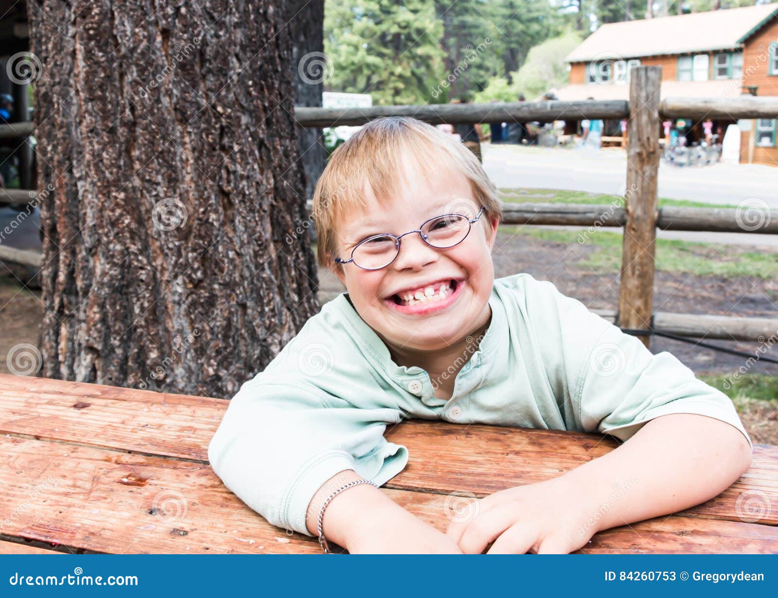 Little Boy with Downs-Syndrome Sitting at Table Stock Image - Image of ...