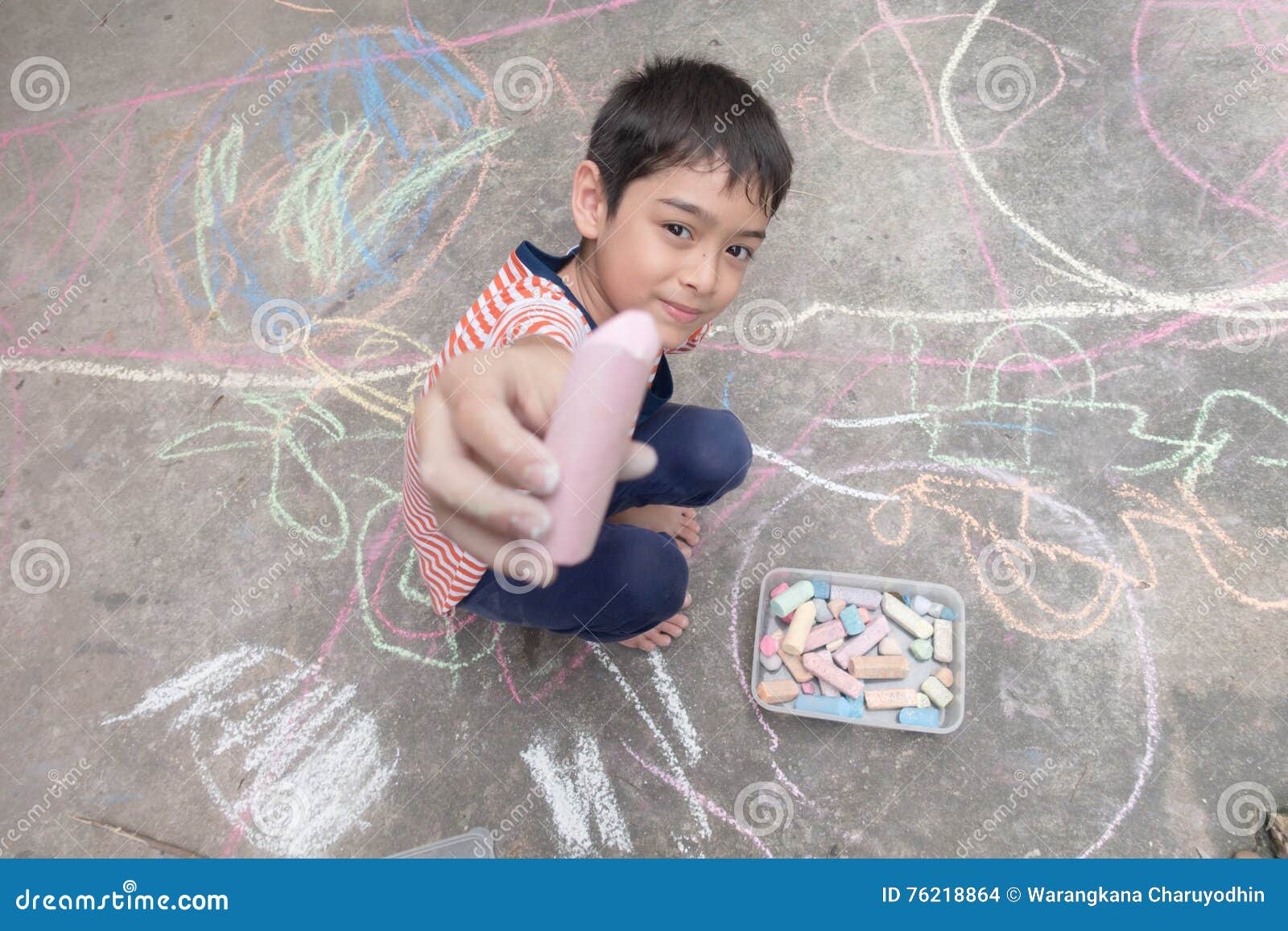 Little Boy Drawing and Coloring by Chalk on the Floor Stock Photo ...