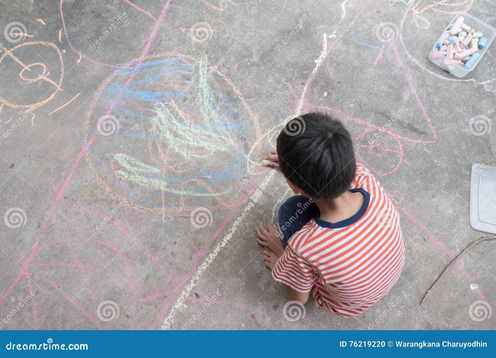 Little Boy Drawing and Coloring by Chalk on the Ground Art Activity ...