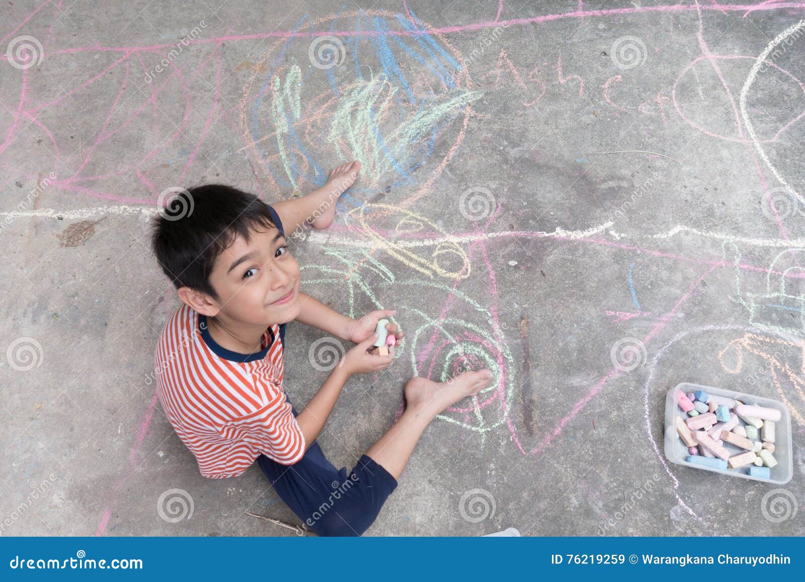 Little Boy Drawing and Coloring by Chalk on the Ground Art Activity ...