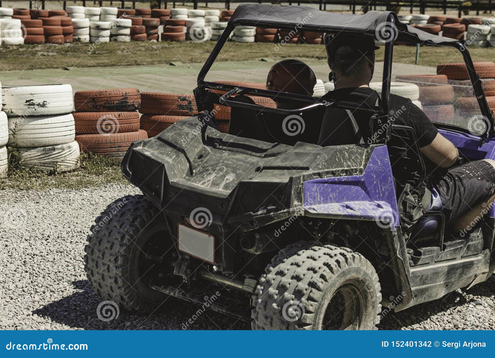 Little Boy Driving a Buggy with His Father Stock Photo - Image of ...