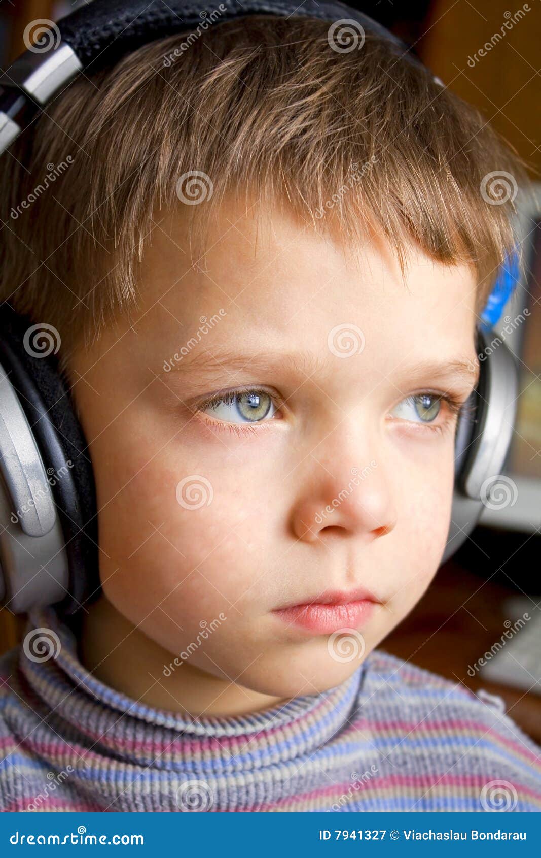Little boy in ear-phones stock image. Image of face, music - 7941327