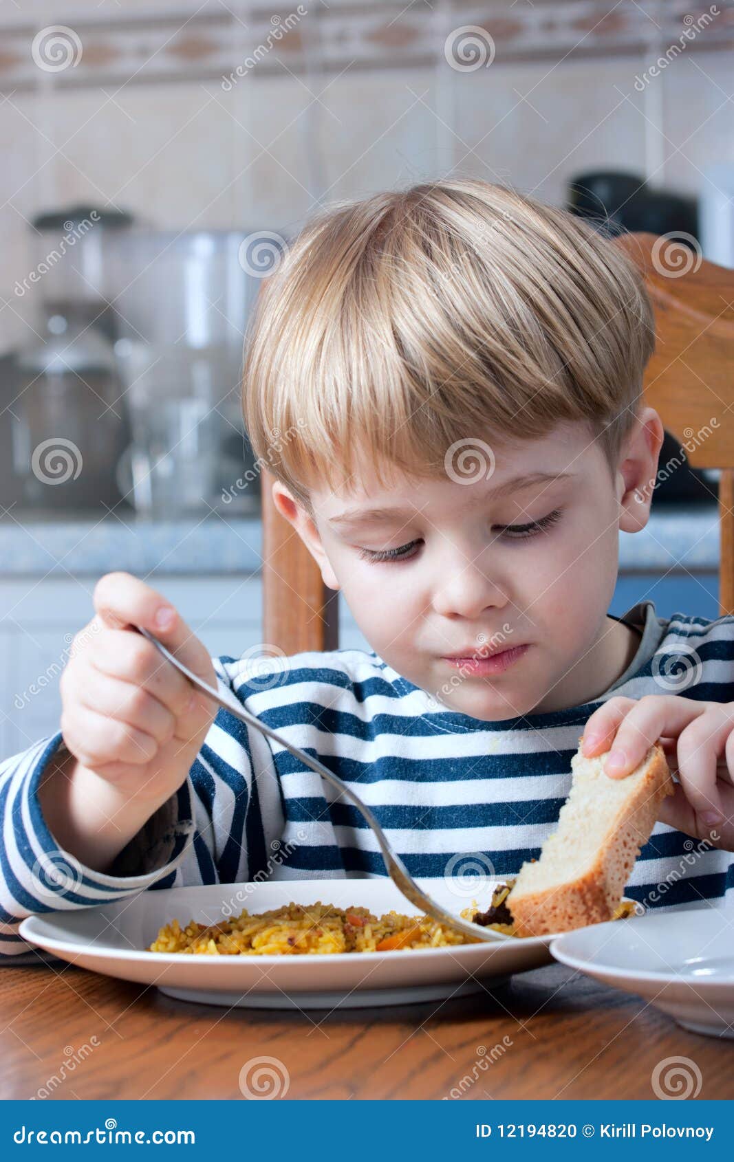 Little boy eating stock photo. Image of diet, holding - 12194820