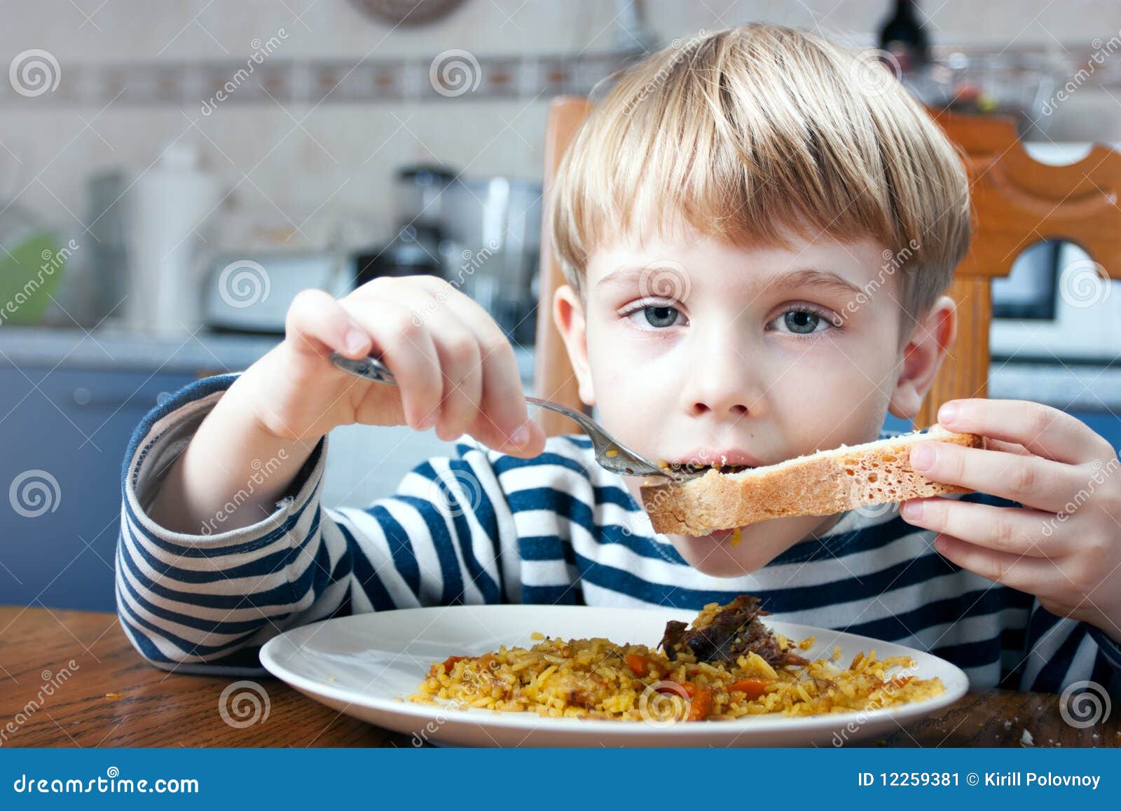 Little boy eating stock image. Image of handsome, male - 12259381