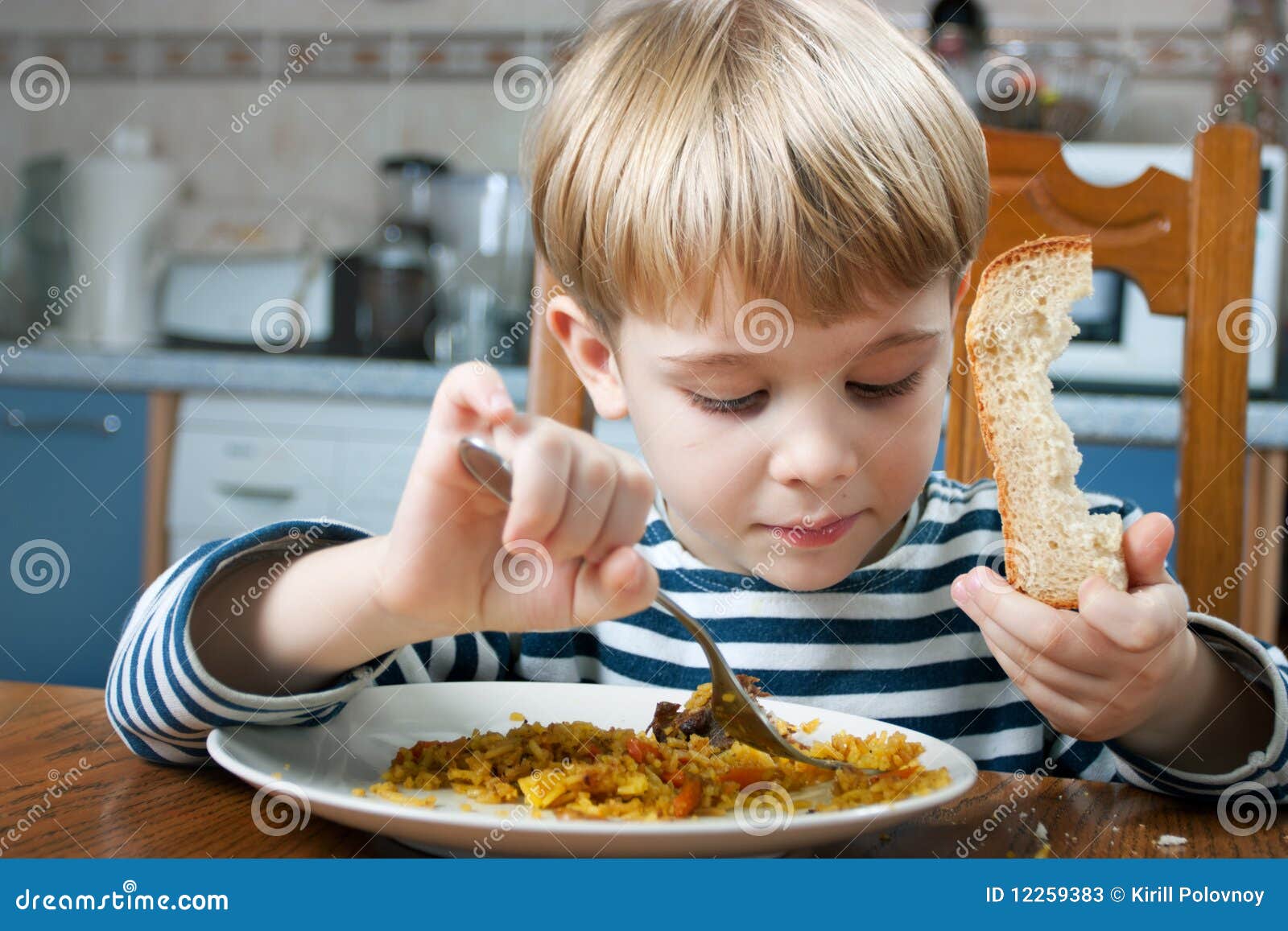 Little boy eating stock image. Image of lunch, cute, bread - 12259383