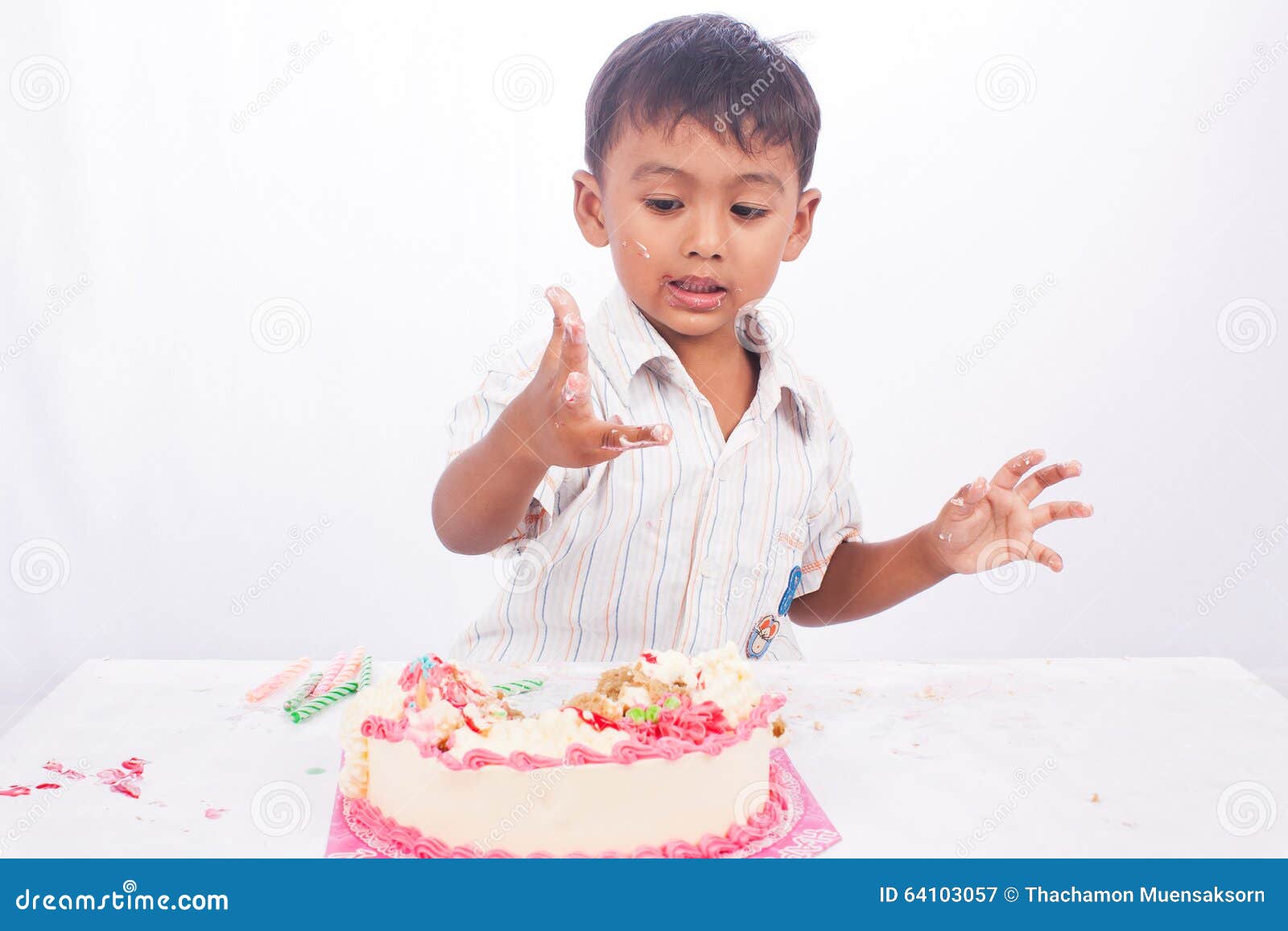 Little boy eating cake stock image. Image of background - 64103057