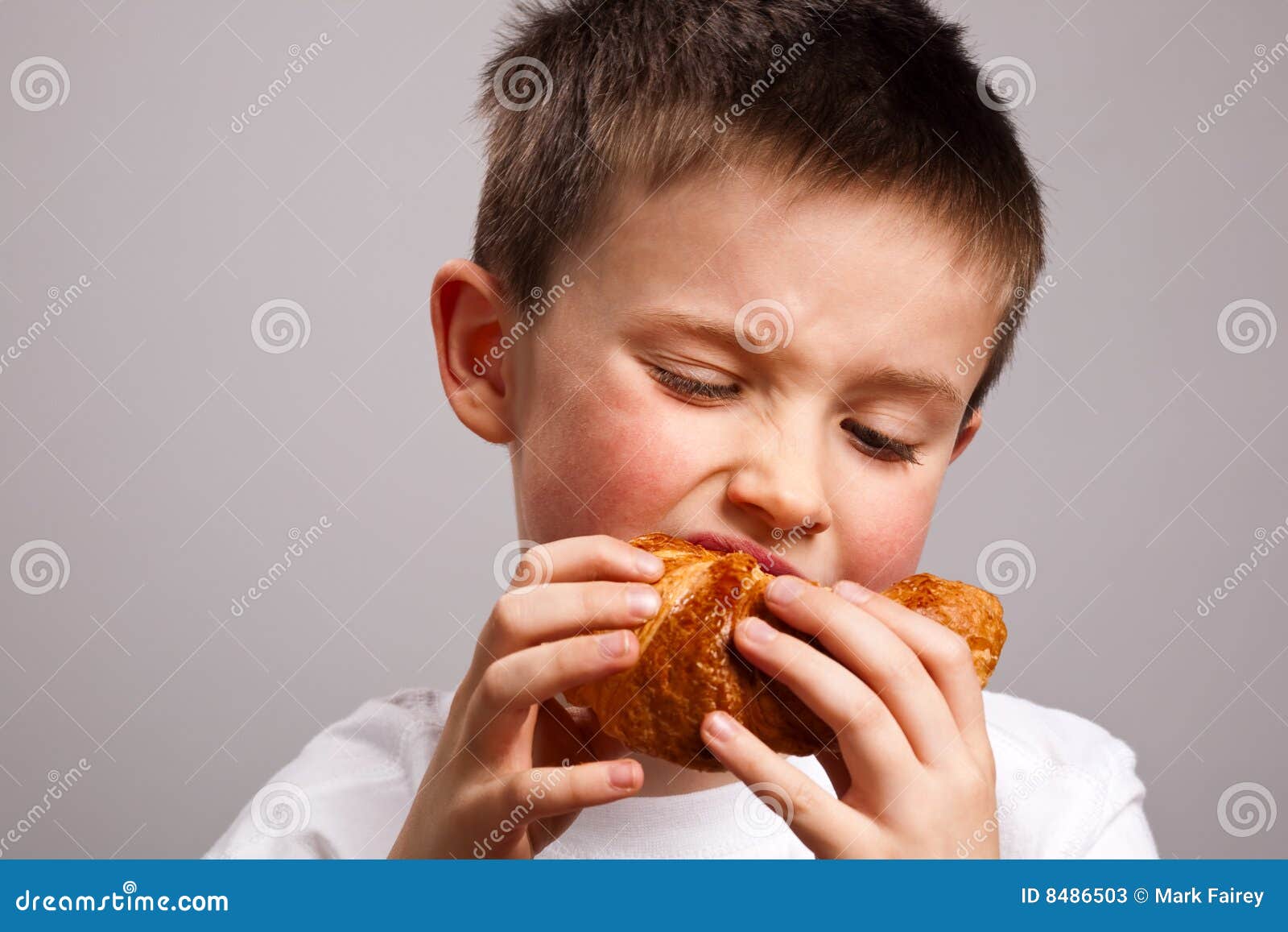 Little Boy Eating a Croissant Stock Image - Image of eating, colour ...
