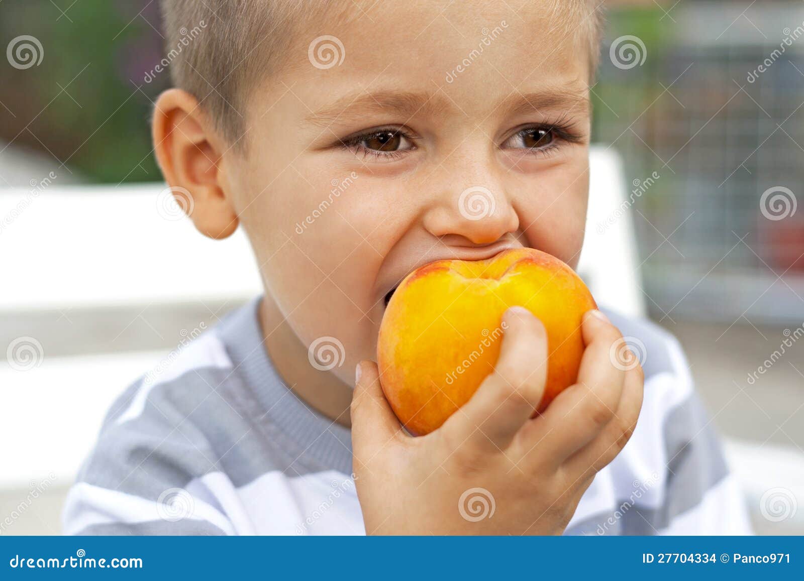 Little Boy Eating Fresh Fruit Stock Photo - Image of outdoors, ripeness ...
