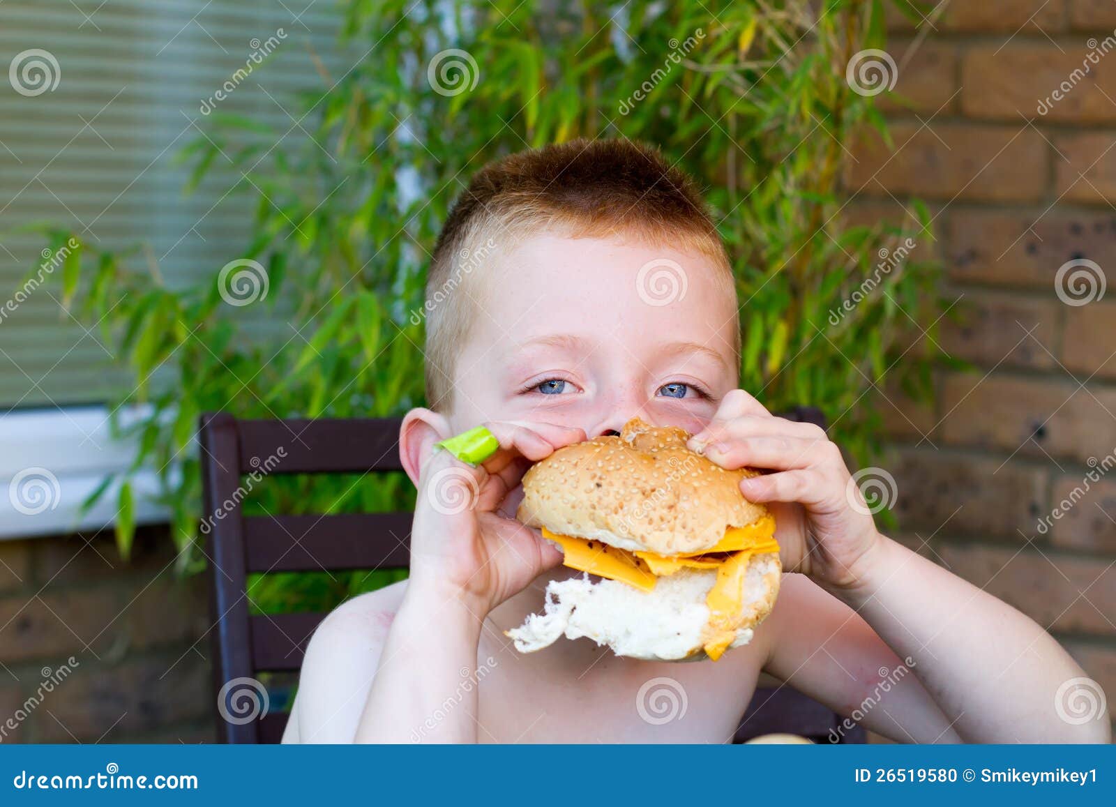 Little Boy Eating a Huge Burger Stock Photo - Image of health, child ...