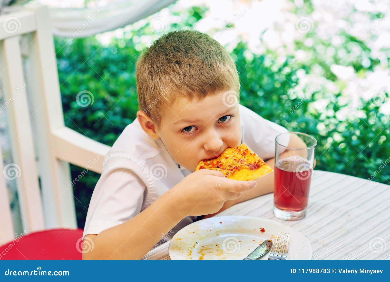 Little Boy Eating Pizza in a Cafe Stock Image - Image of lunch, holding ...