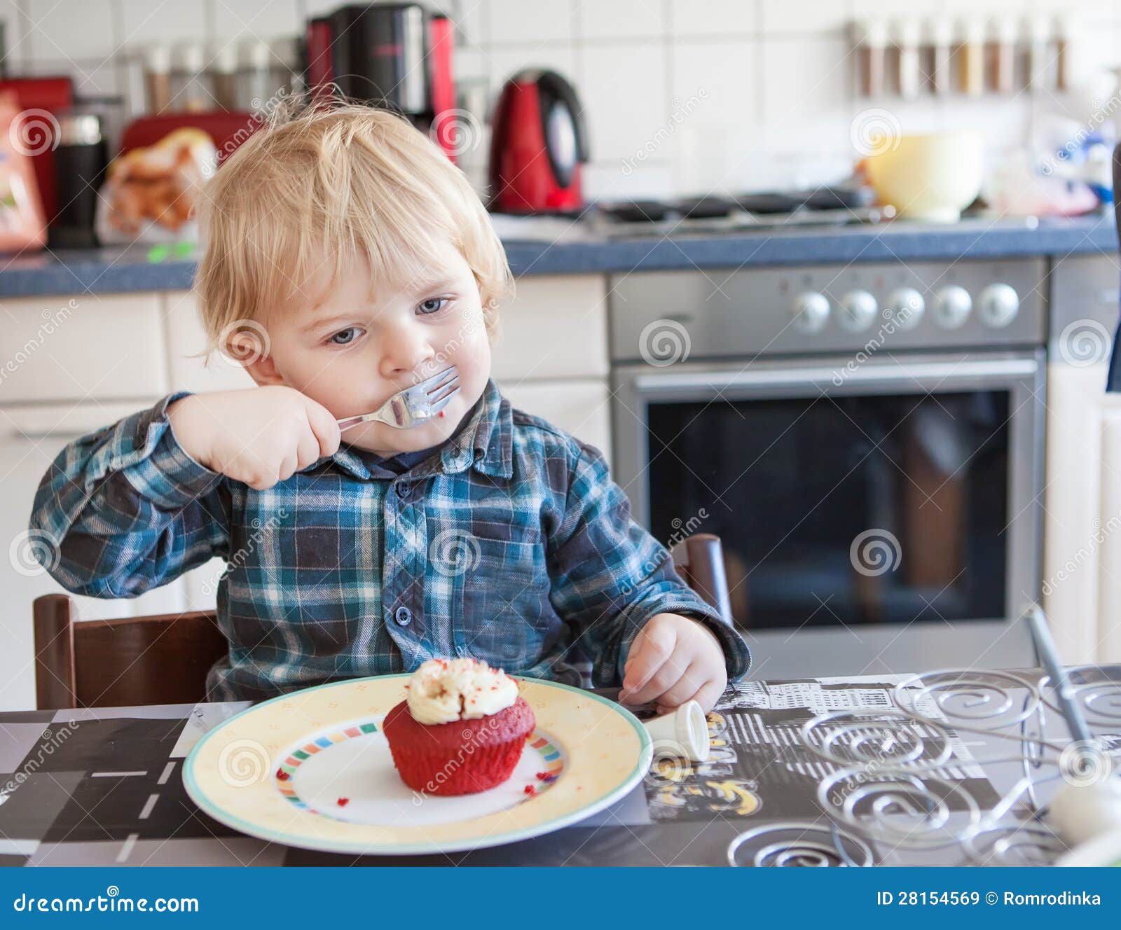 Little Boy Eating Red Cupcake Stock Image - Image of baby, person: 28154569