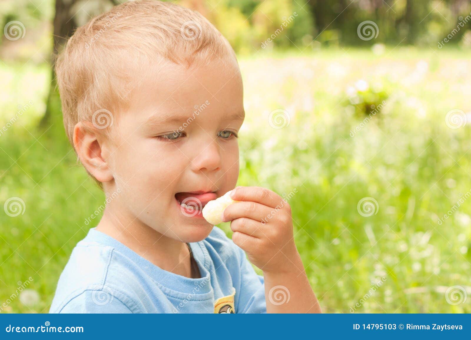 Little boy eating a snack. stock image. Image of food - 14795103