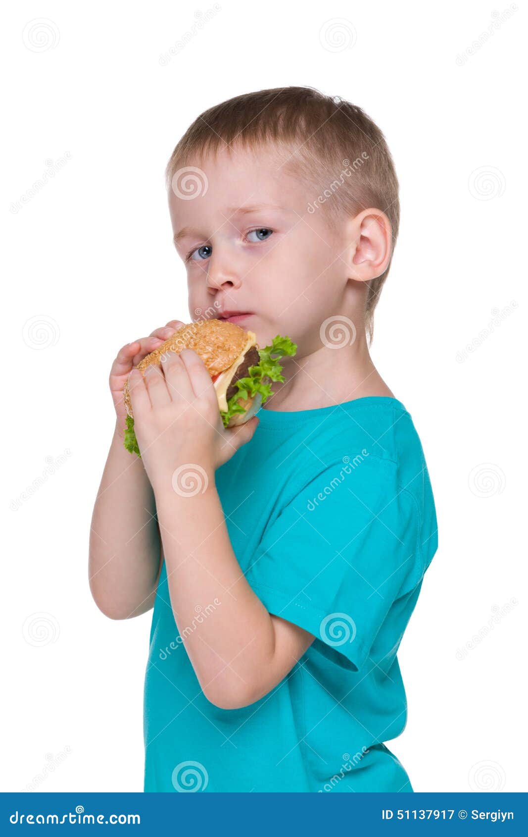 Little boy eats hamburger stock image. Image of person - 51137917