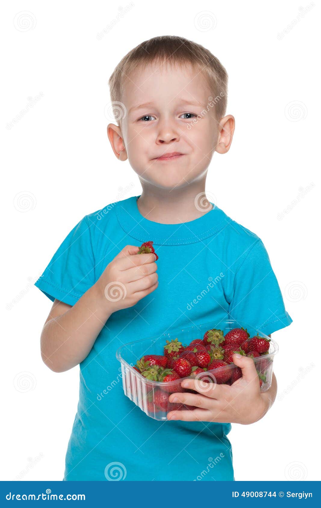 Little boy eats strawberry stock photo. Image of small - 49008744