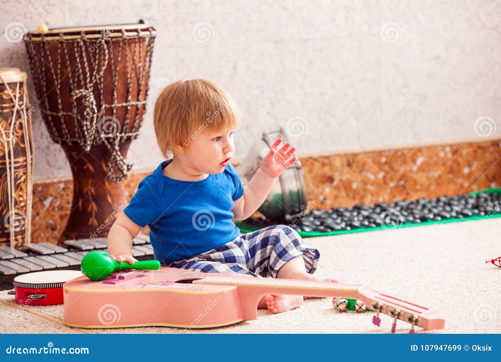 Boy with Musical Instruments Stock Image - Image of floor, colorful ...