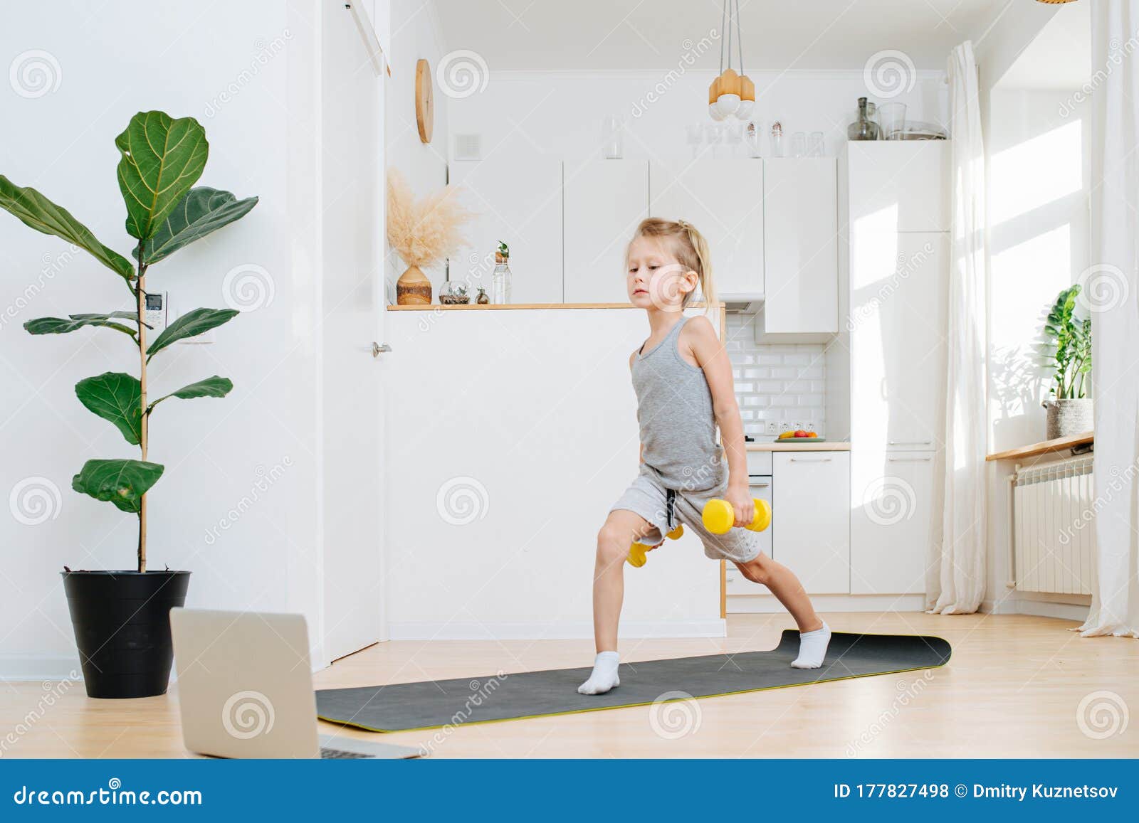 Little Boy Exercising with Dumbbells, Doing Forward Lunges Stock Photo ...