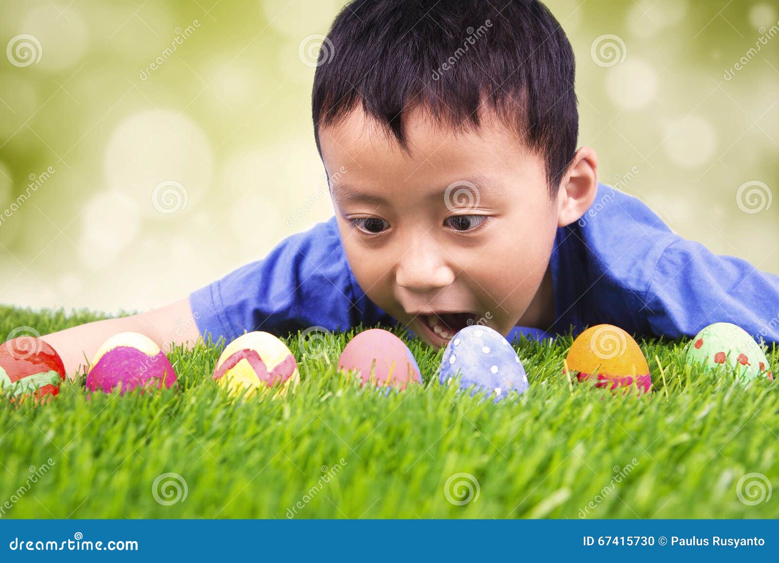 Little Boy Finding Easter Eggs on Grass Stock Photo - Image of hide ...