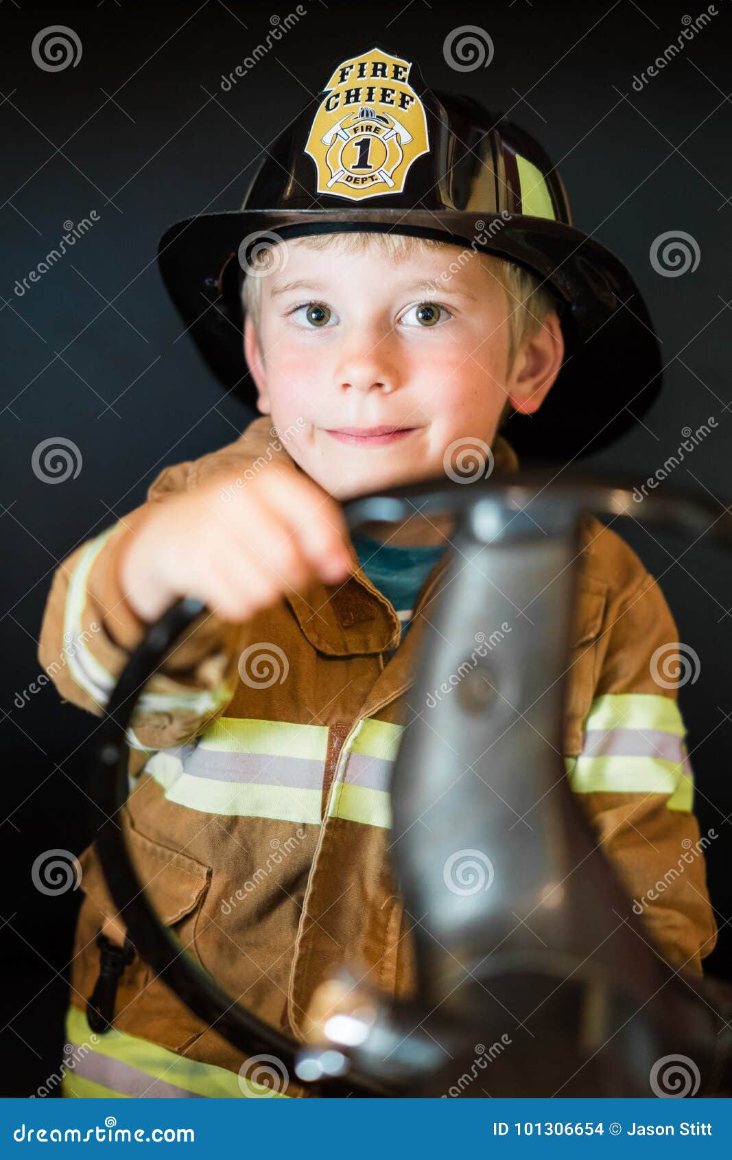 Little Boy Firefighter stock photo. Image of helmet - 101306654