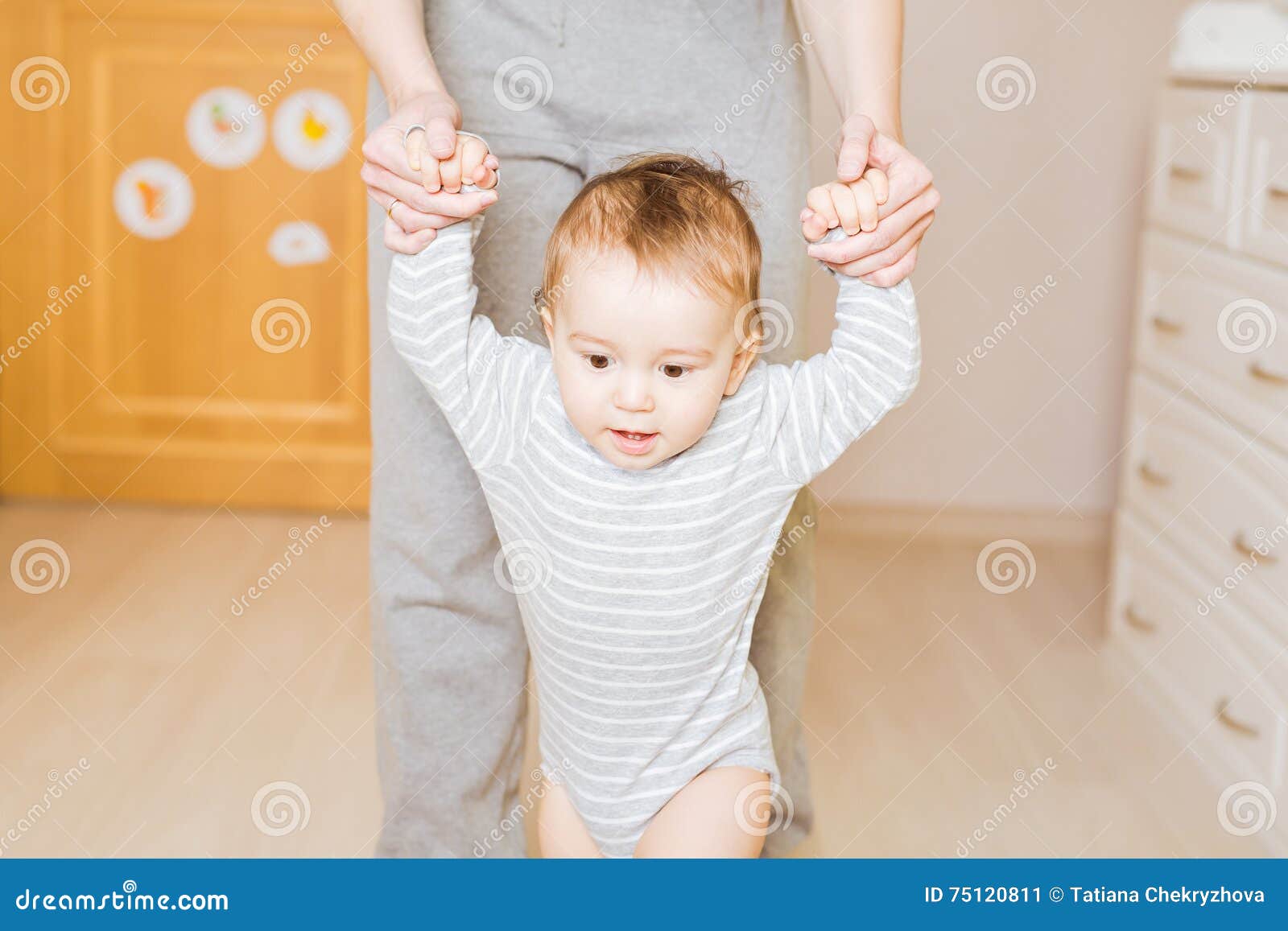 Little Boy First Steps with the Help of Mother Stock Image - Image of ...