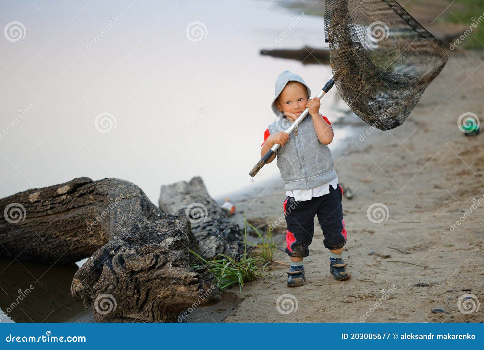 Little Boy Fishing with a Net for Fish Stock Image - Image of holiday ...
