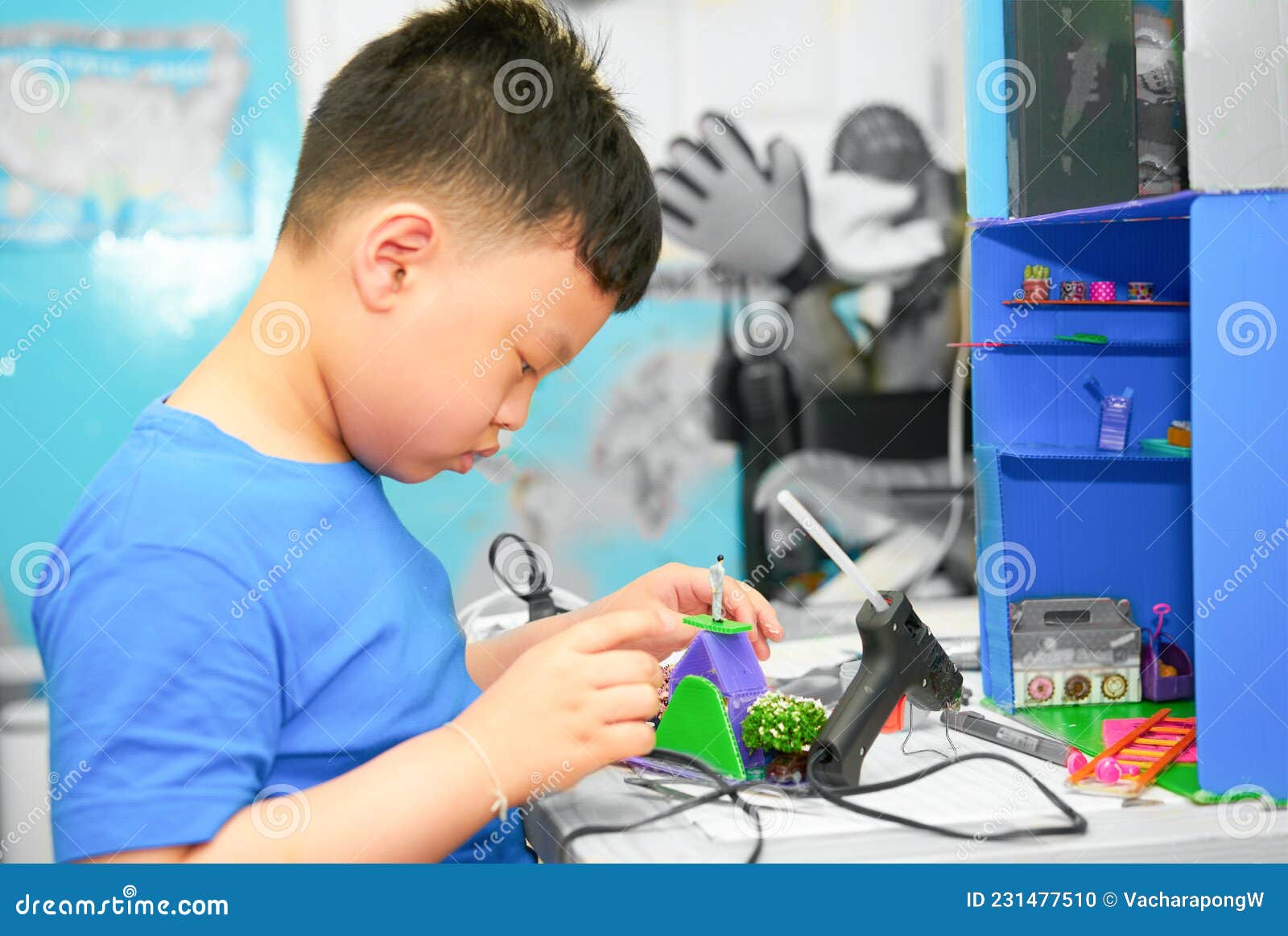 Little Boy Fix and Crafting Toy on Table at Home Stock Photo - Image of ...