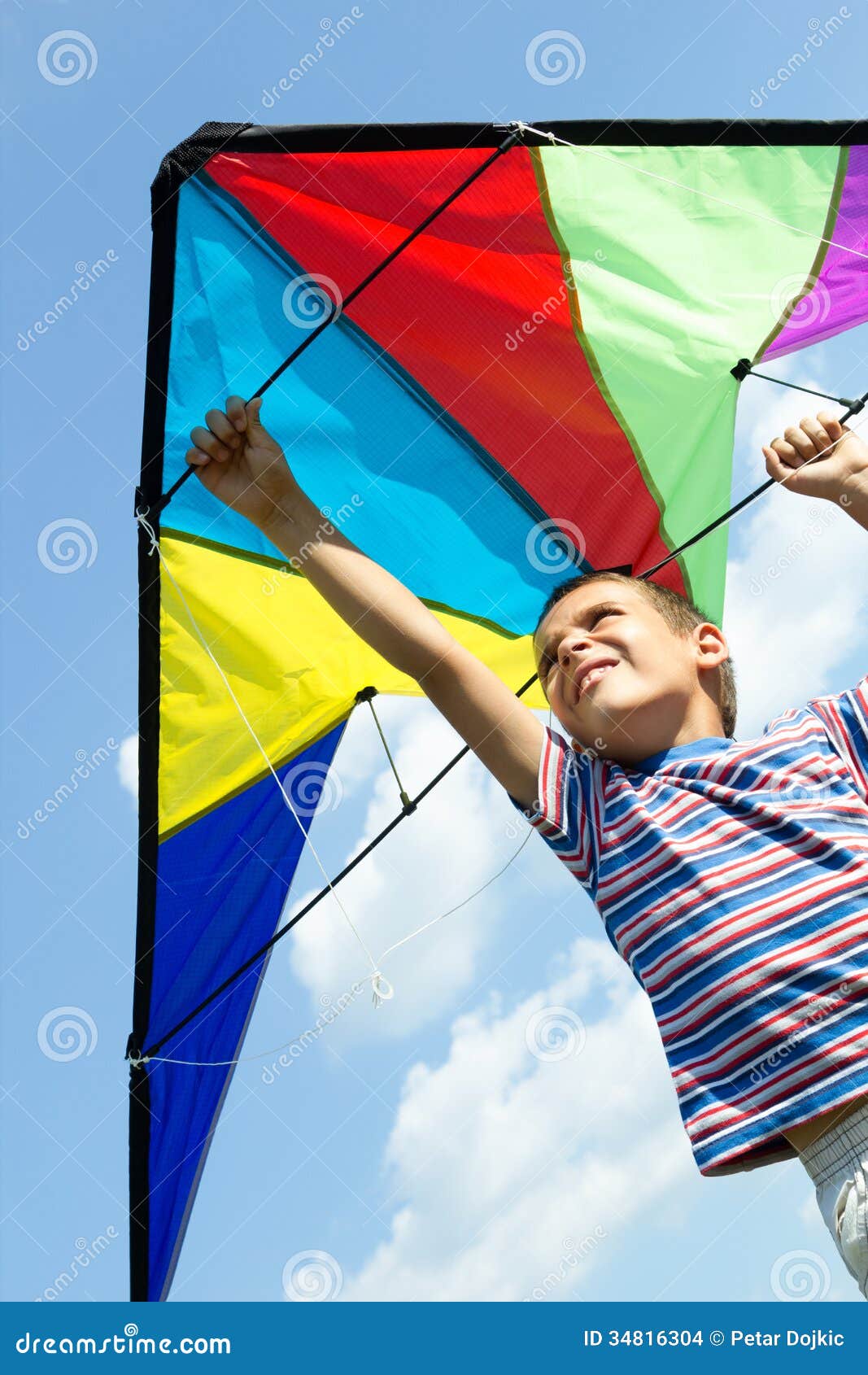Little Boy Flies a Kite into the Blue Sky Stock Photo - Image of ...