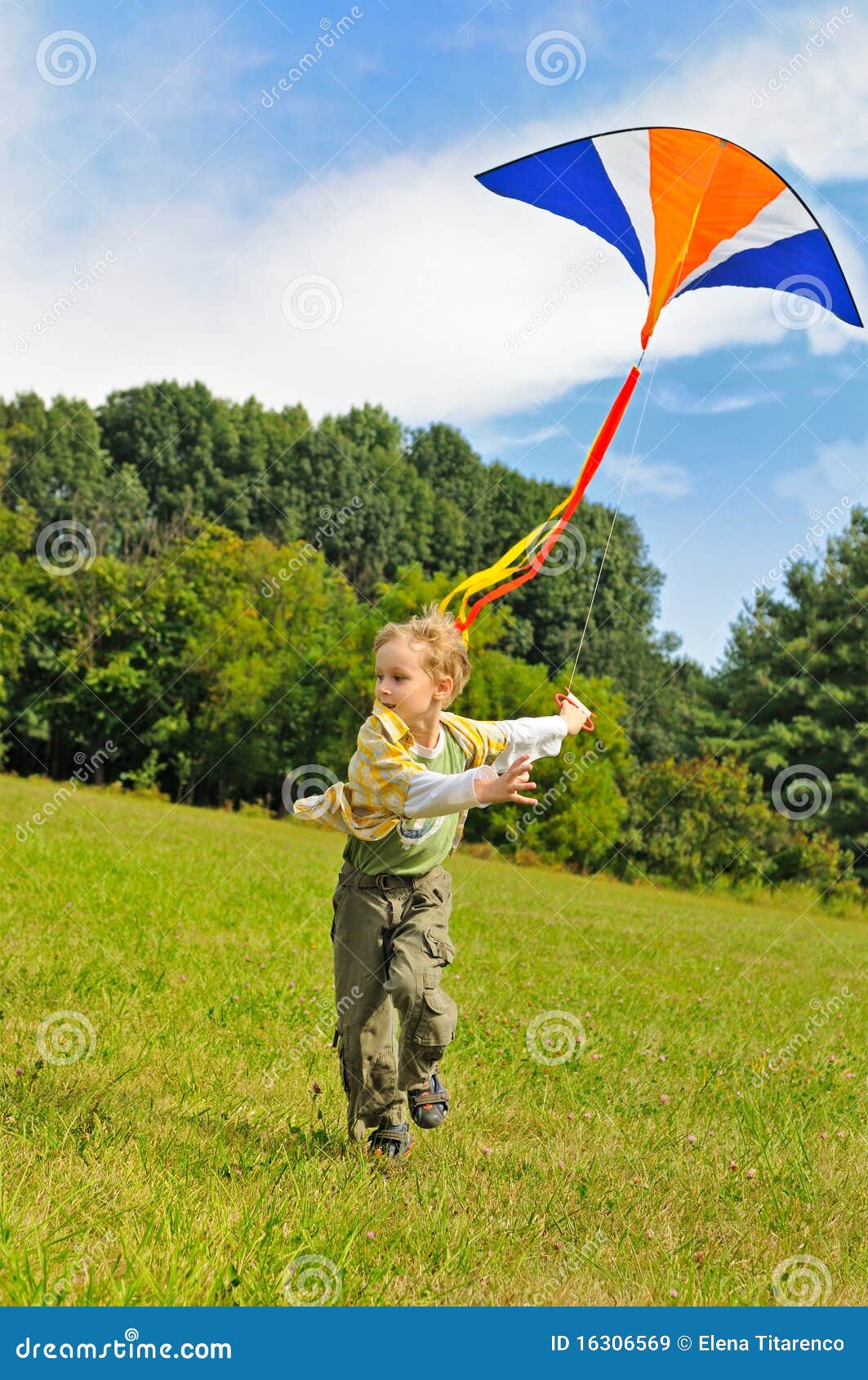 Little boy flying a kite stock image. Image of action - 16306569