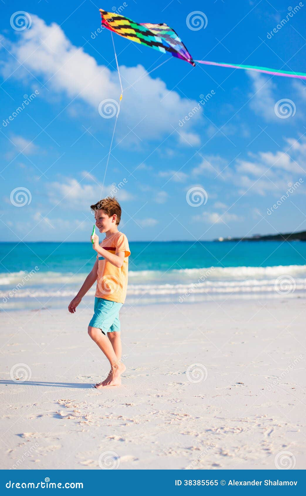 Little boy flying a kite stock image. Image of coastline - 38385565