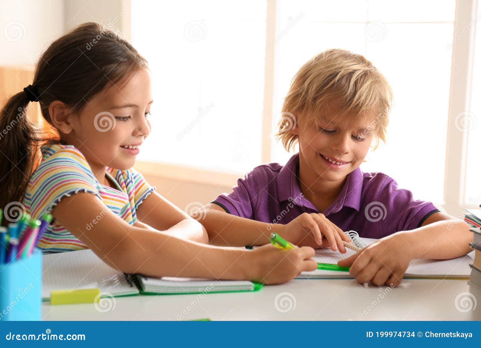 Little Boy and Girl Doing Homework at Table Indoors Stock Photo - Image ...