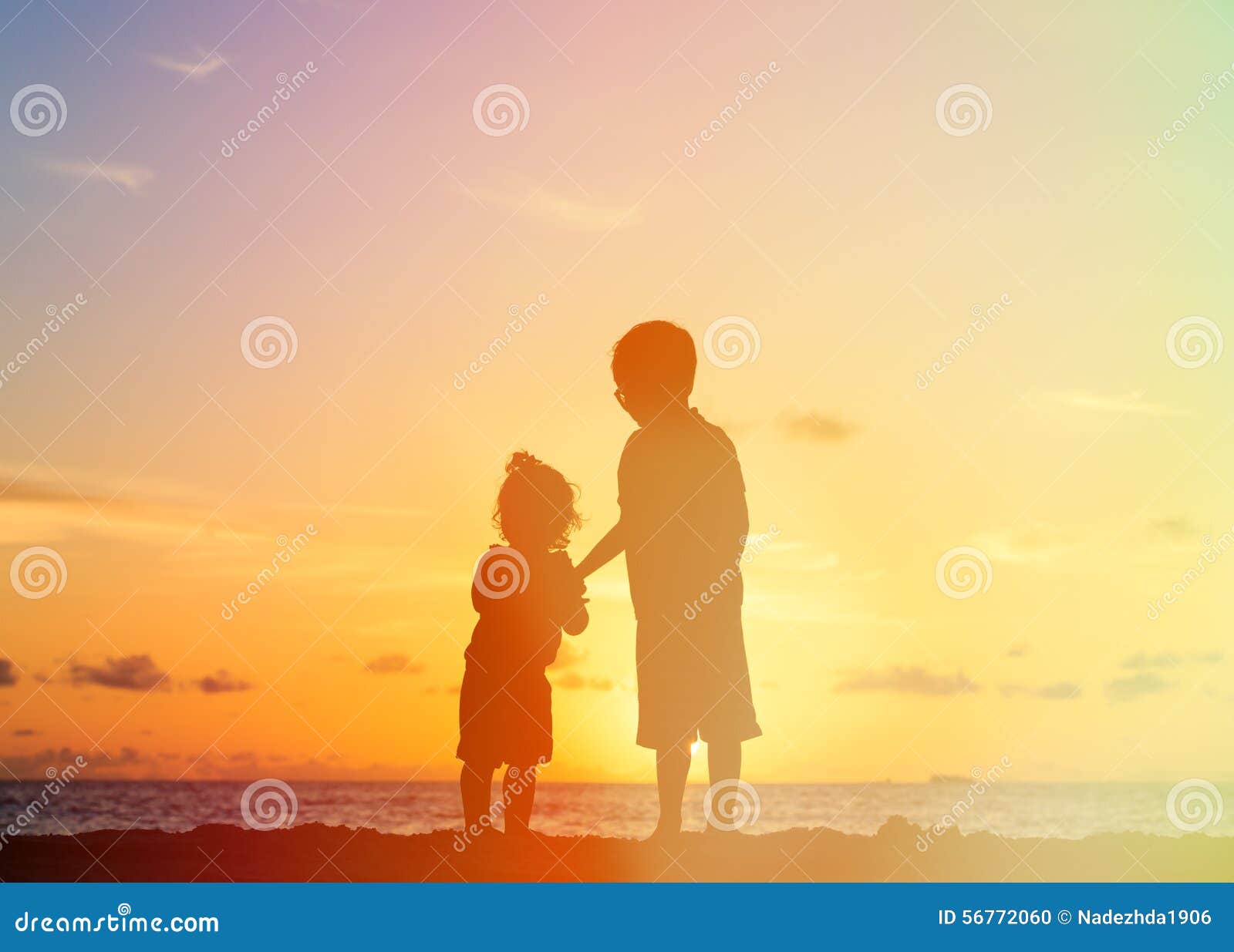 Little Boy and Girl Holding Hands at Sunset Stock Photo - Image of ...