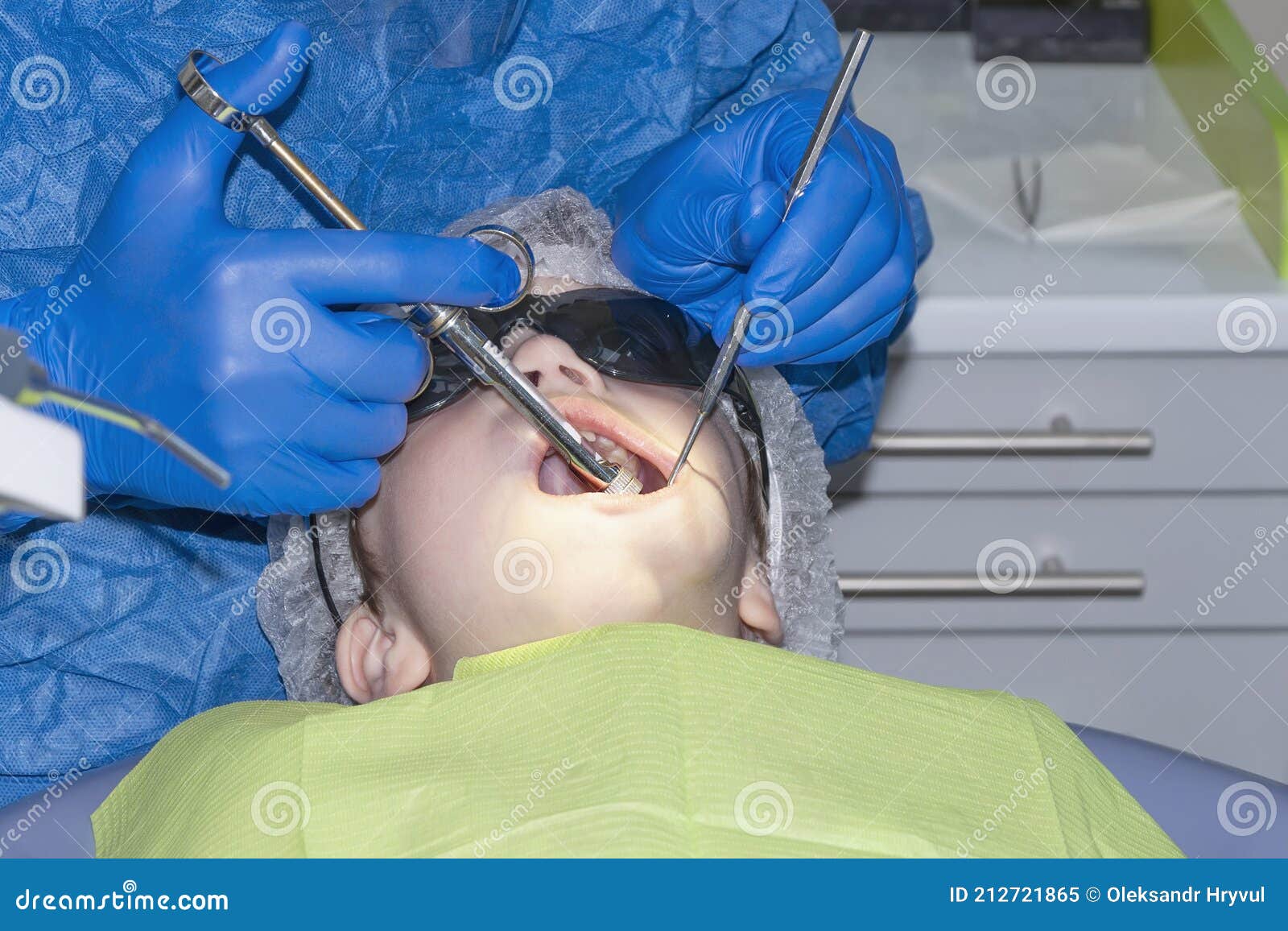 The Little Boy is Given an Injection of Anesthesia before Dental ...