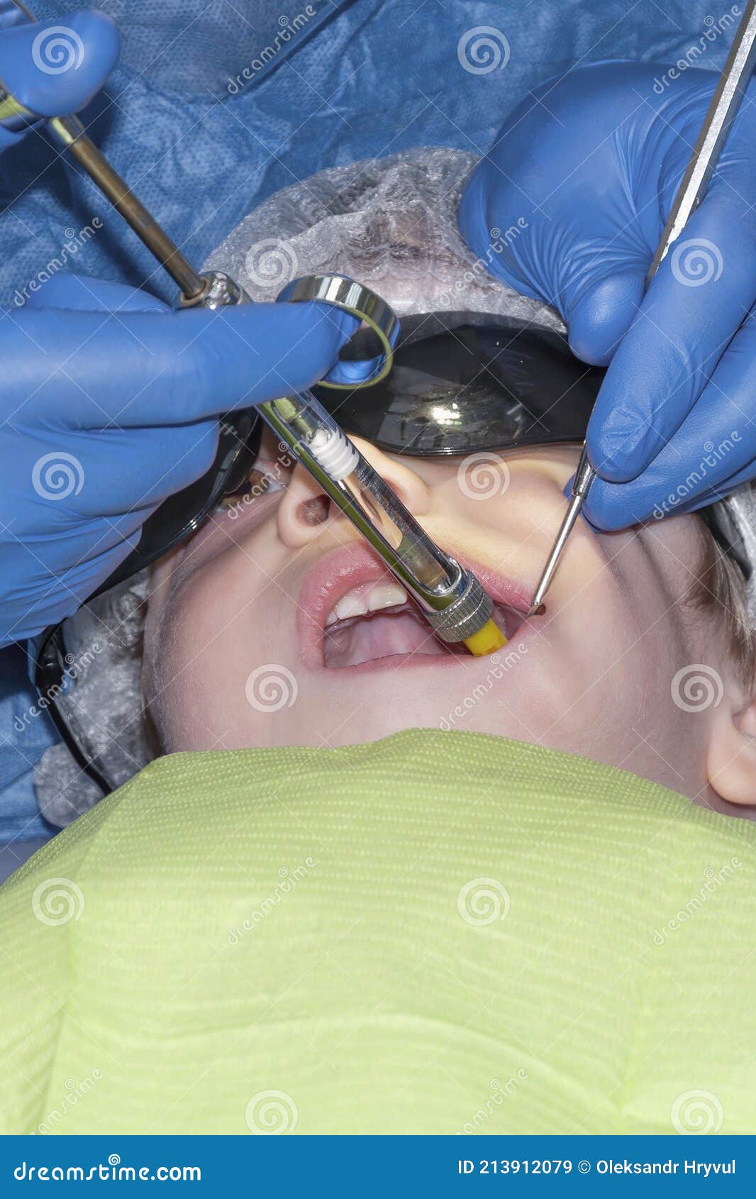 The Little Boy is Given an Injection of Anesthesia before Dental ...