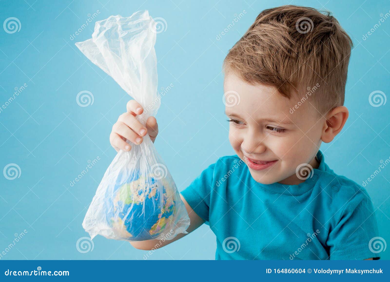 Little Boy with a Globe in a Package on a Blue Background Stock Photo ...