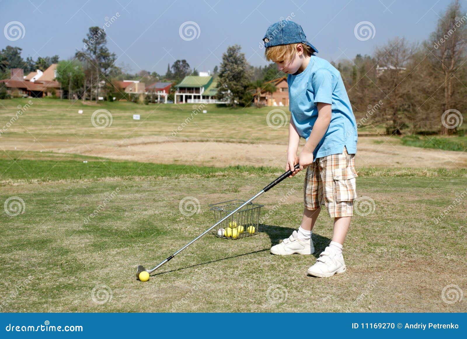 Little boy on a golf field stock photo. Image of beautiful - 11169270