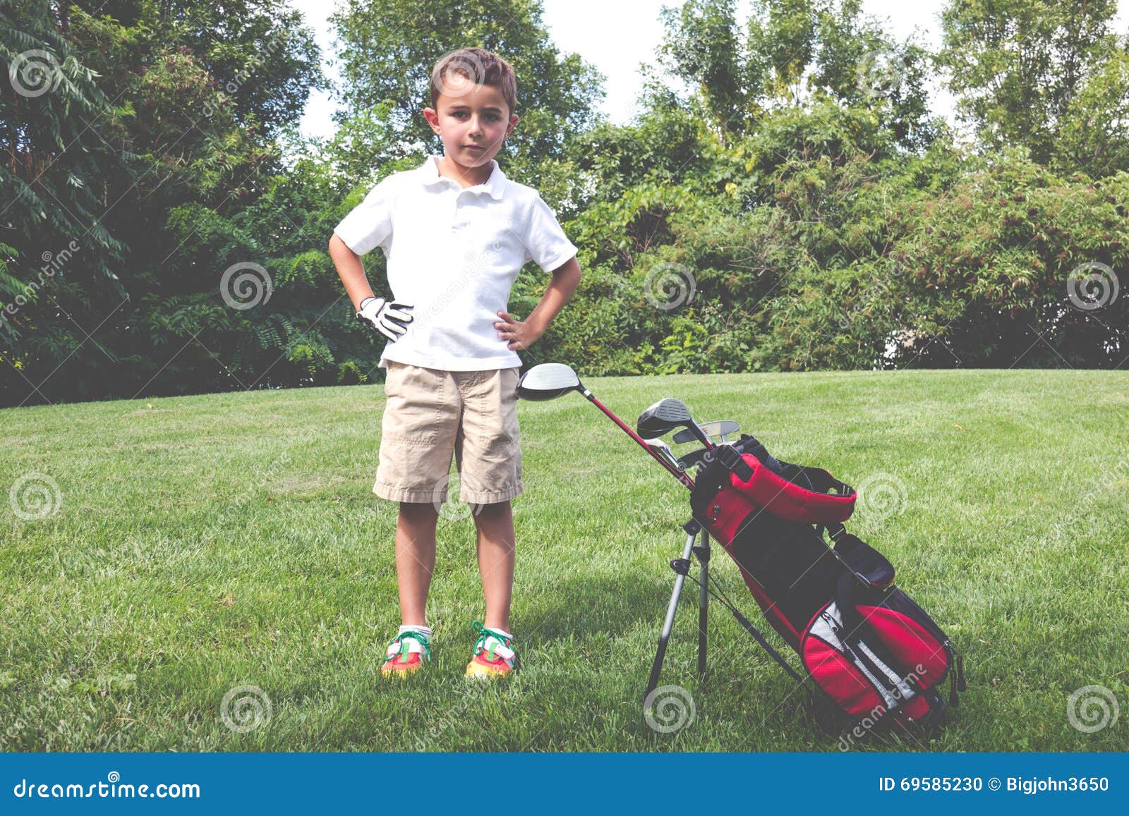 Little Boy Golfer with His Golf Bag on the Fairway Stock Photo - Image ...