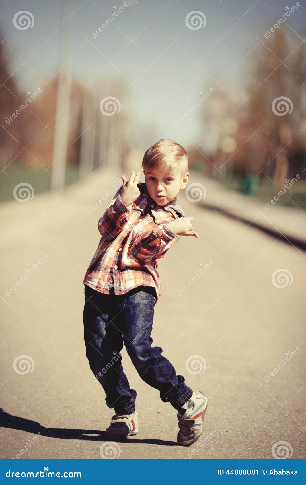 Little Boy Grimacing on the Street Stock Image - Image of beautiful ...