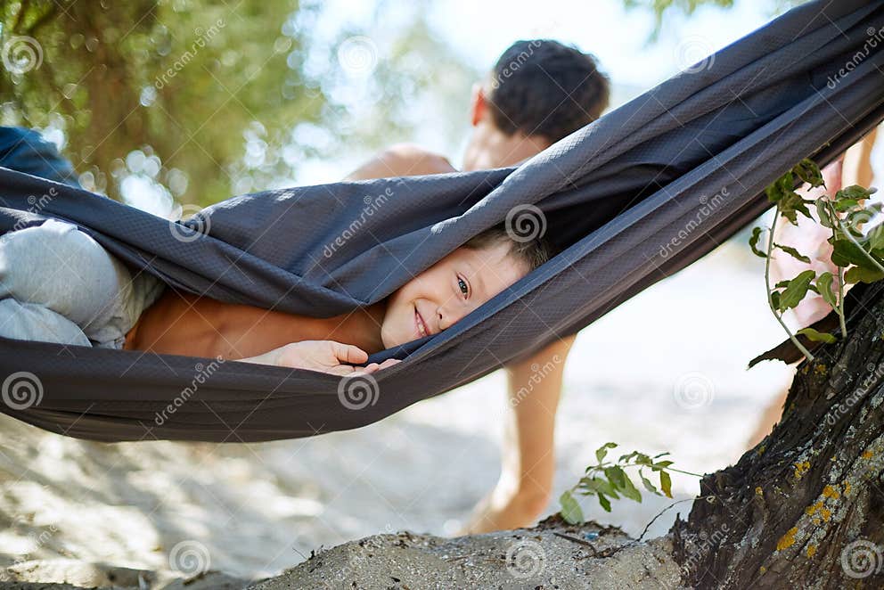 Little boy in the hammock stock image. Image of sand - 59583201