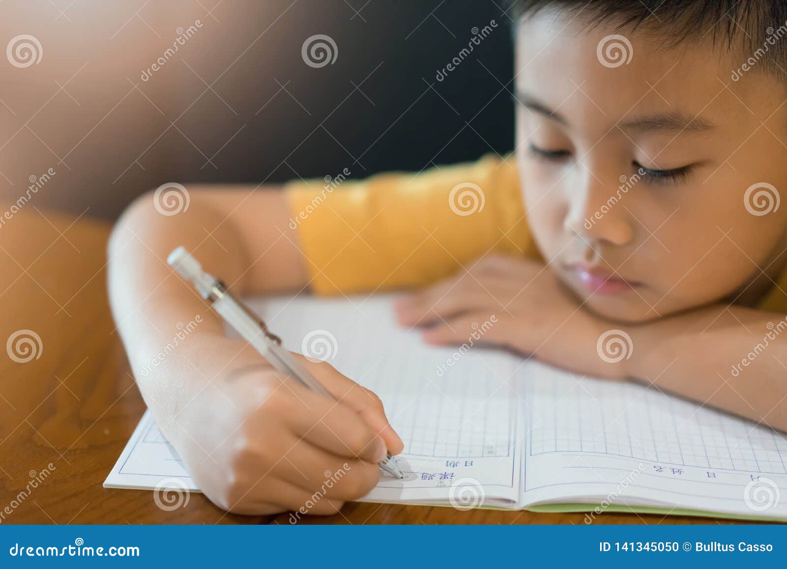 Little Boy Hand is Writing Homework at Home. Stock Photo - Image of ...
